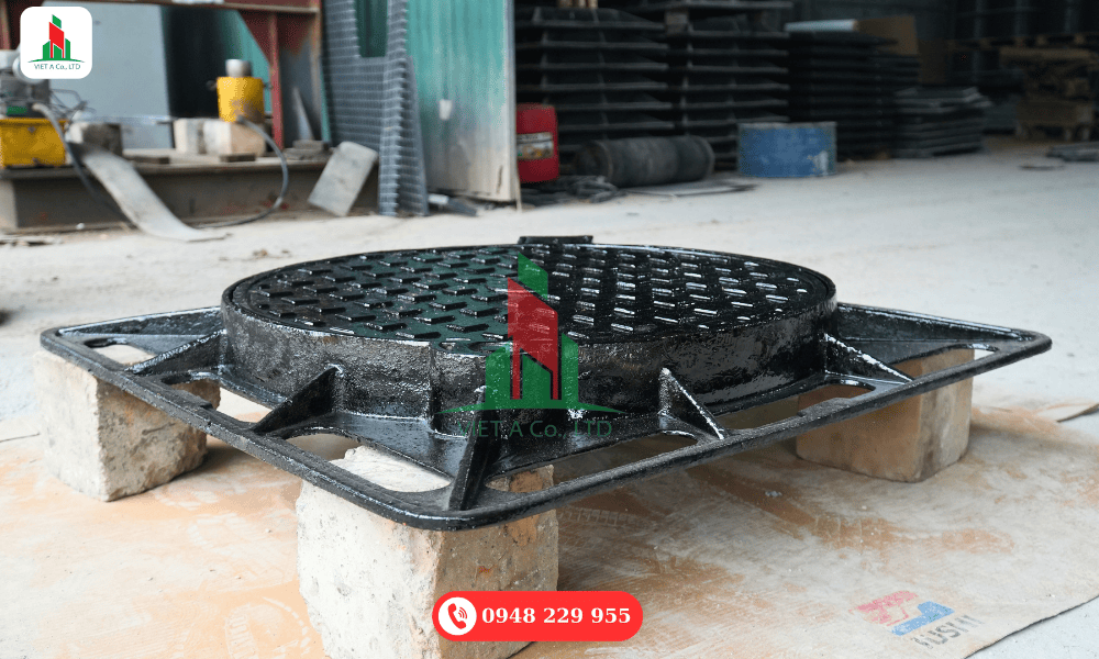 Close-up of the manhole cover and cast iron grating foundry